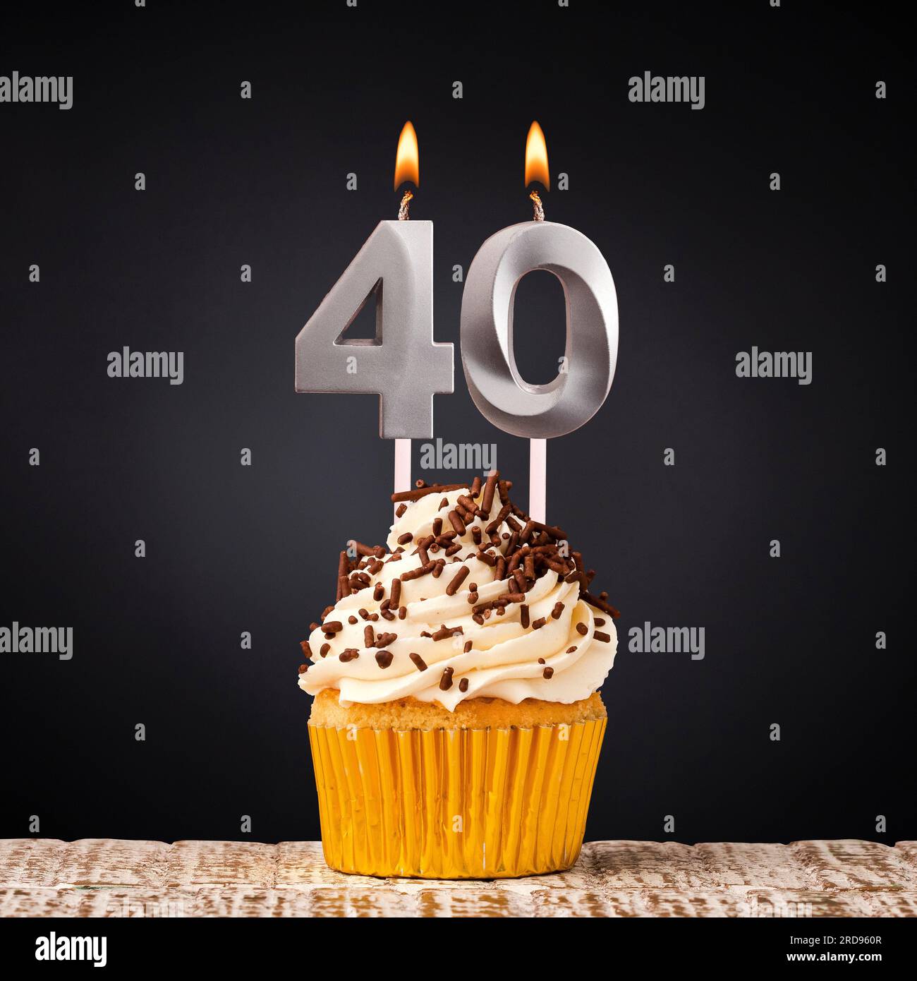 birthday cupcake with number 40 candle - Celebration on dark background ...