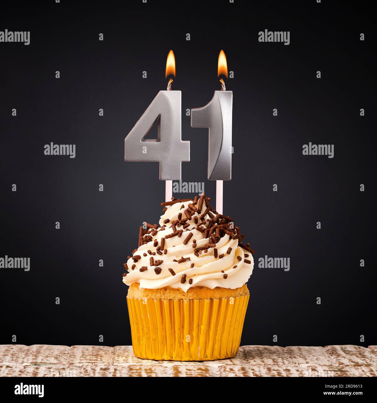 Birthday candle number 41 - Anniversary cupcake on black background ...