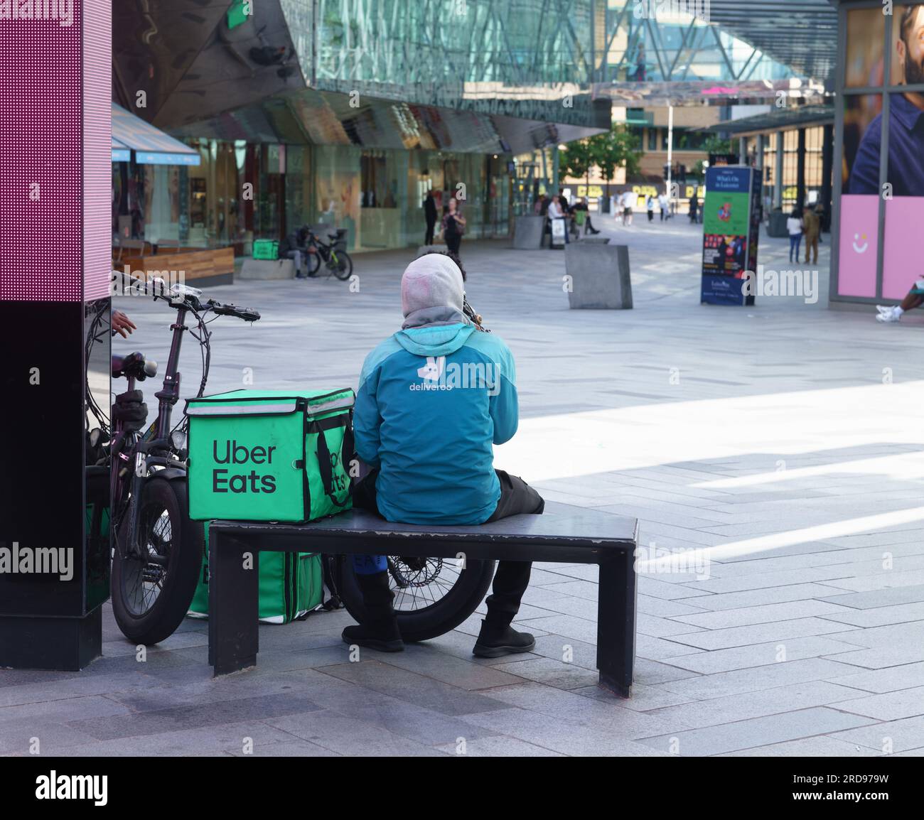 An 'Uber Eats' rider waits in St Peter's Square, Leicester, UK Stock ...
