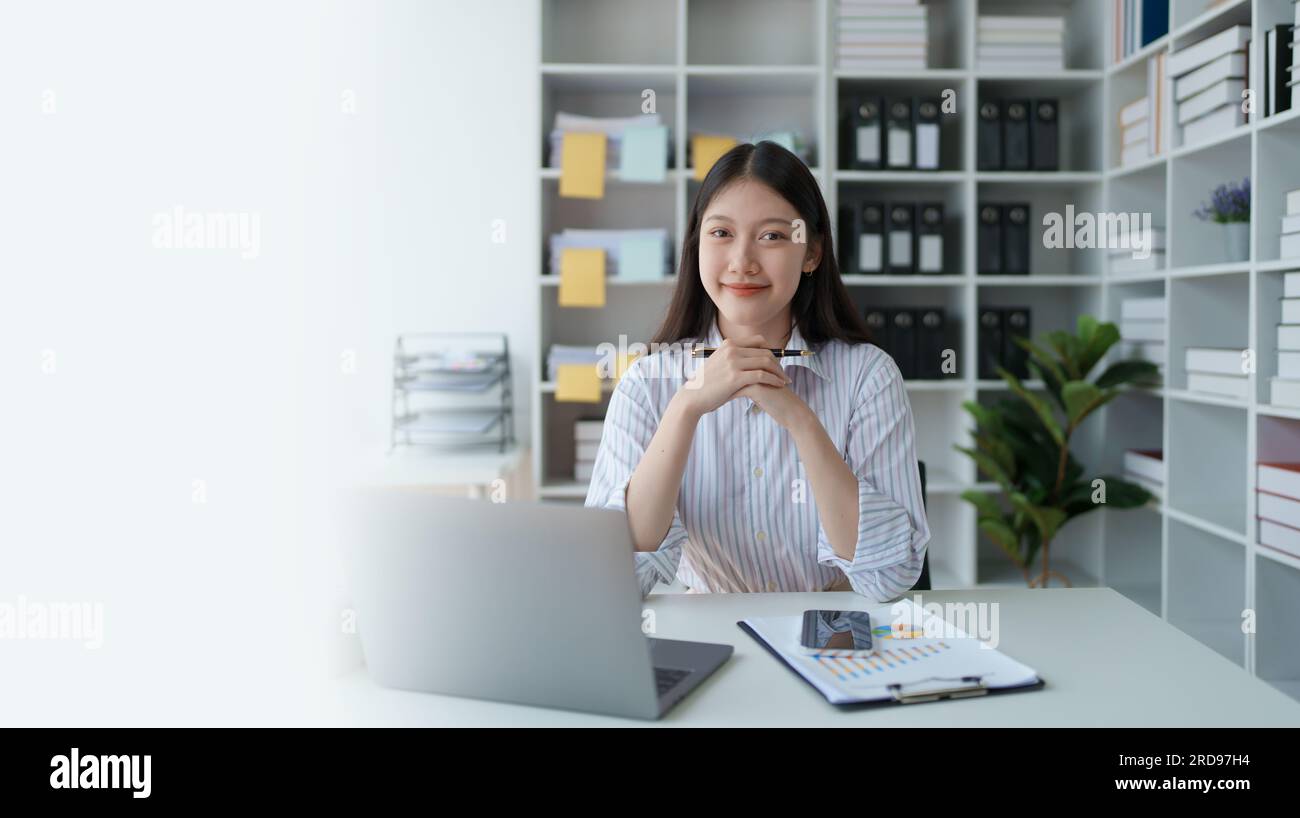 Portrait of a woman business owner showing a happy smiling face as he ...