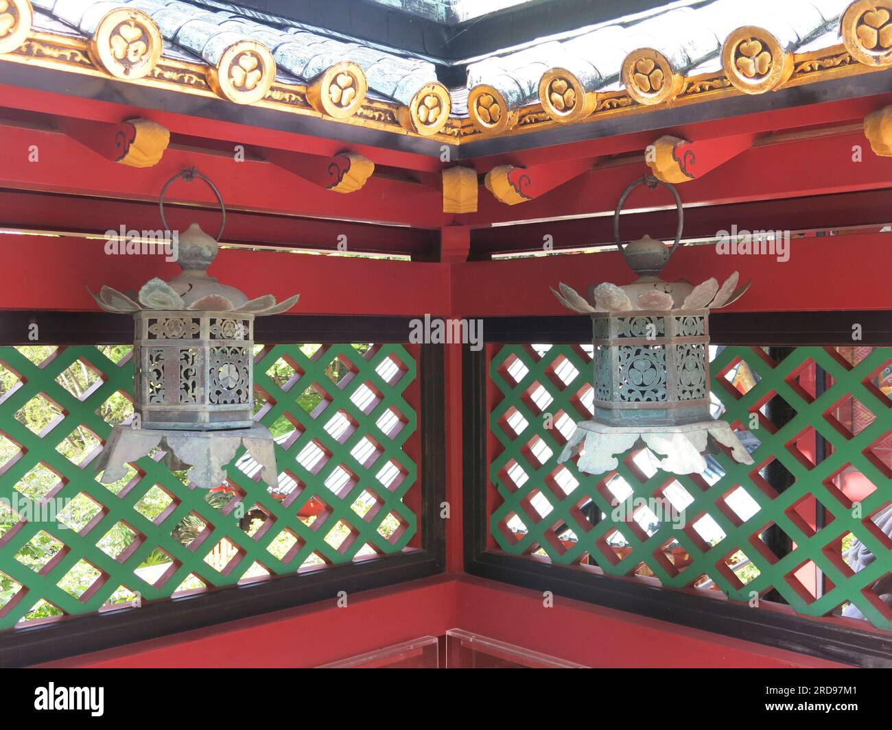 Ornate lanterns, lattice-work and colourful painted woodwork; detail of ...