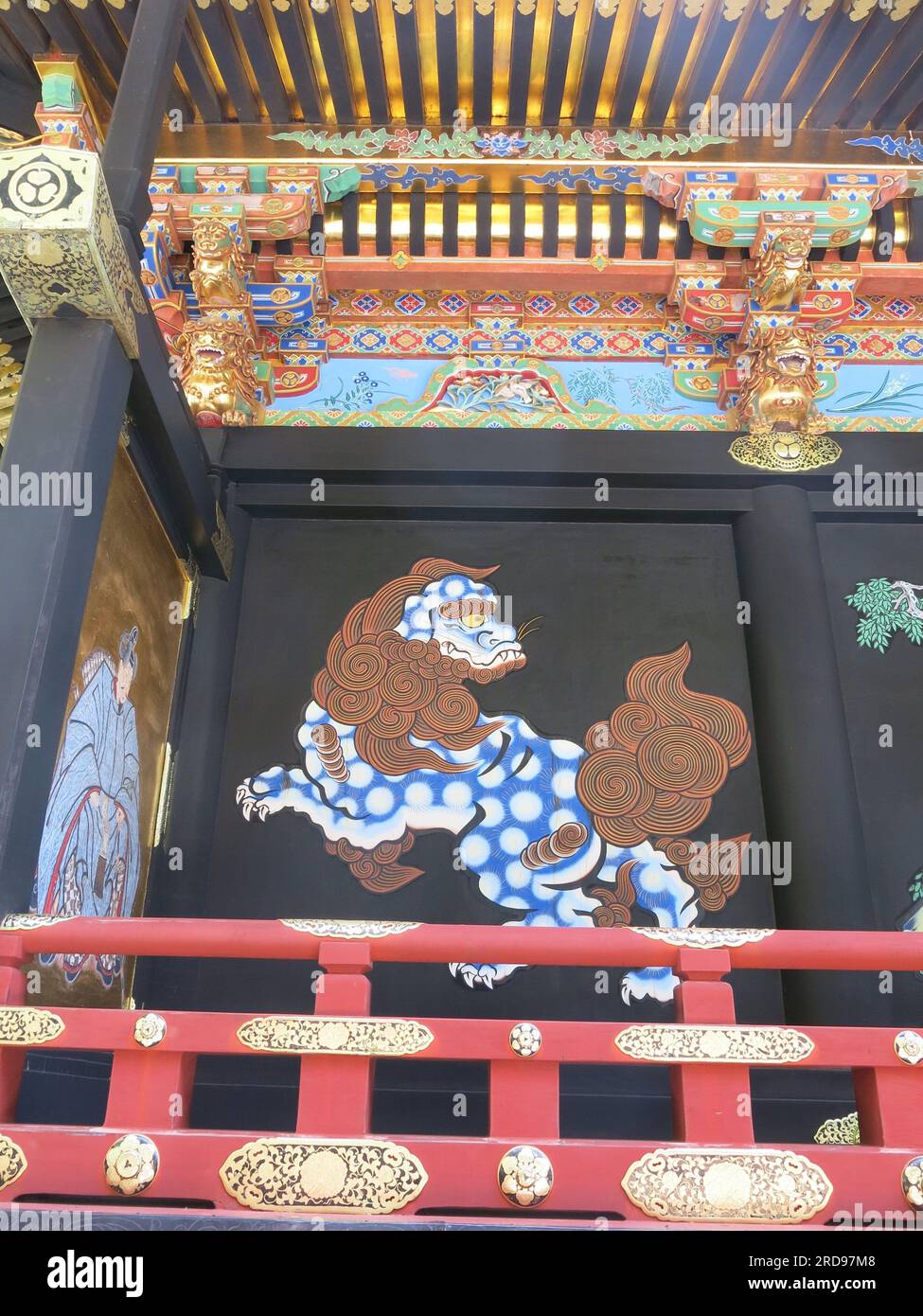 Detail of the brightly coloured painting and ornate woodwork on one of ...