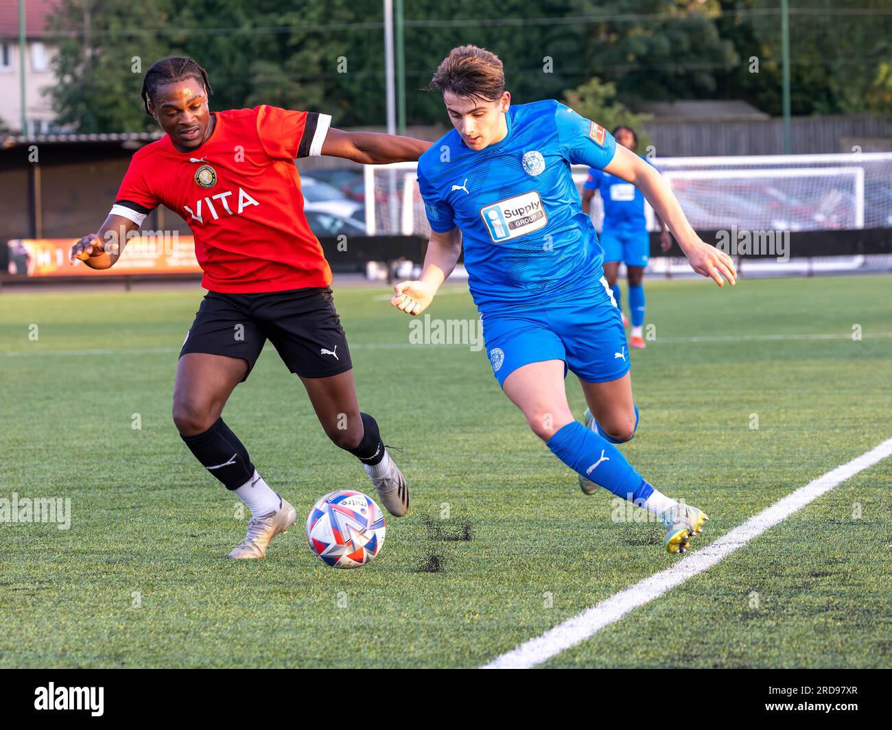 Warrington Rylands player runs down the left wing chased by a Stockport ...