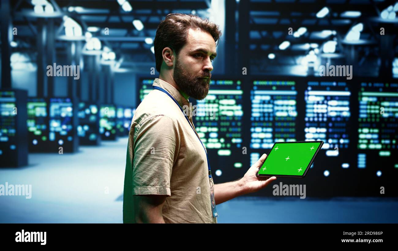 Computer Scientist Using Green Screen Tablet To Verify Data Center Configuration Settings