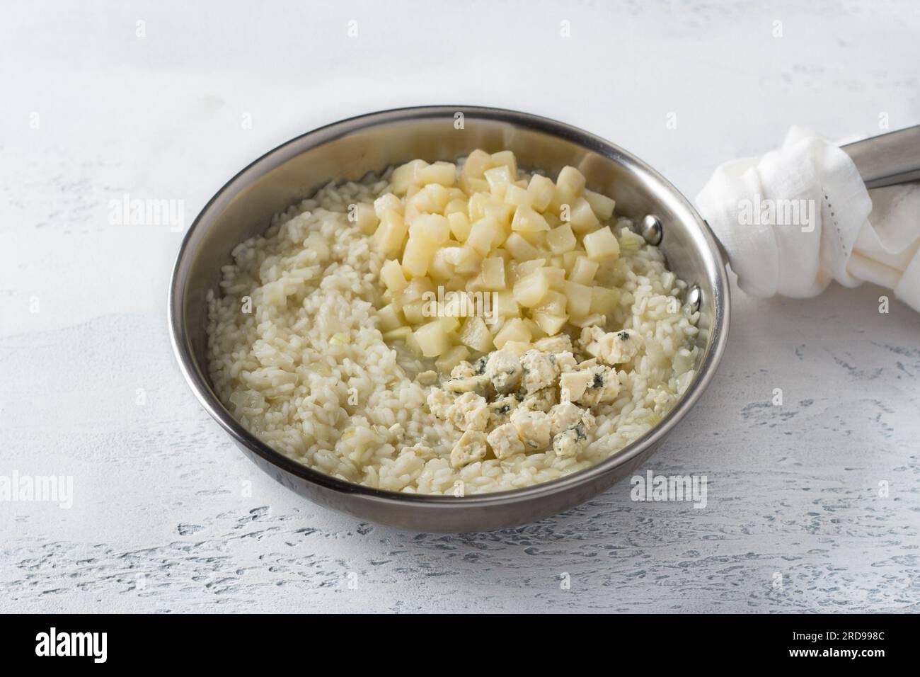 Frying pan risotto, cooking step by step, step 6, adding pear and blue ...
