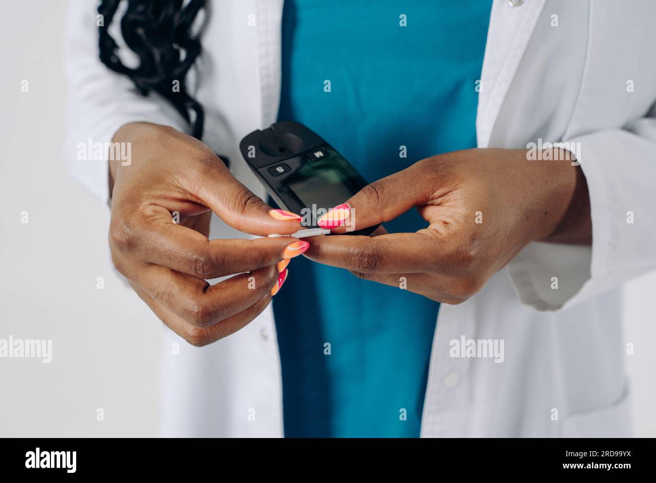 Doctor measuring blood sugar level of diabetic patient in clinic, self ...