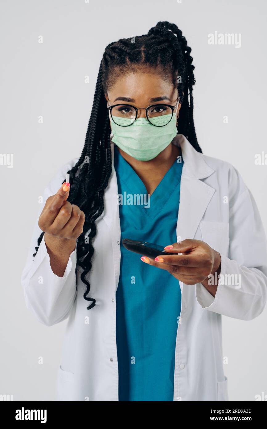 Doctor measuring blood sugar level of diabetic patient in clinic, self ...