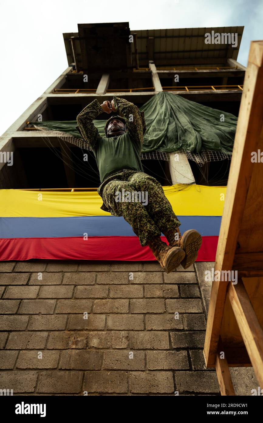A Colombian reconnaissance Marine demonstrates proper jumping form ...