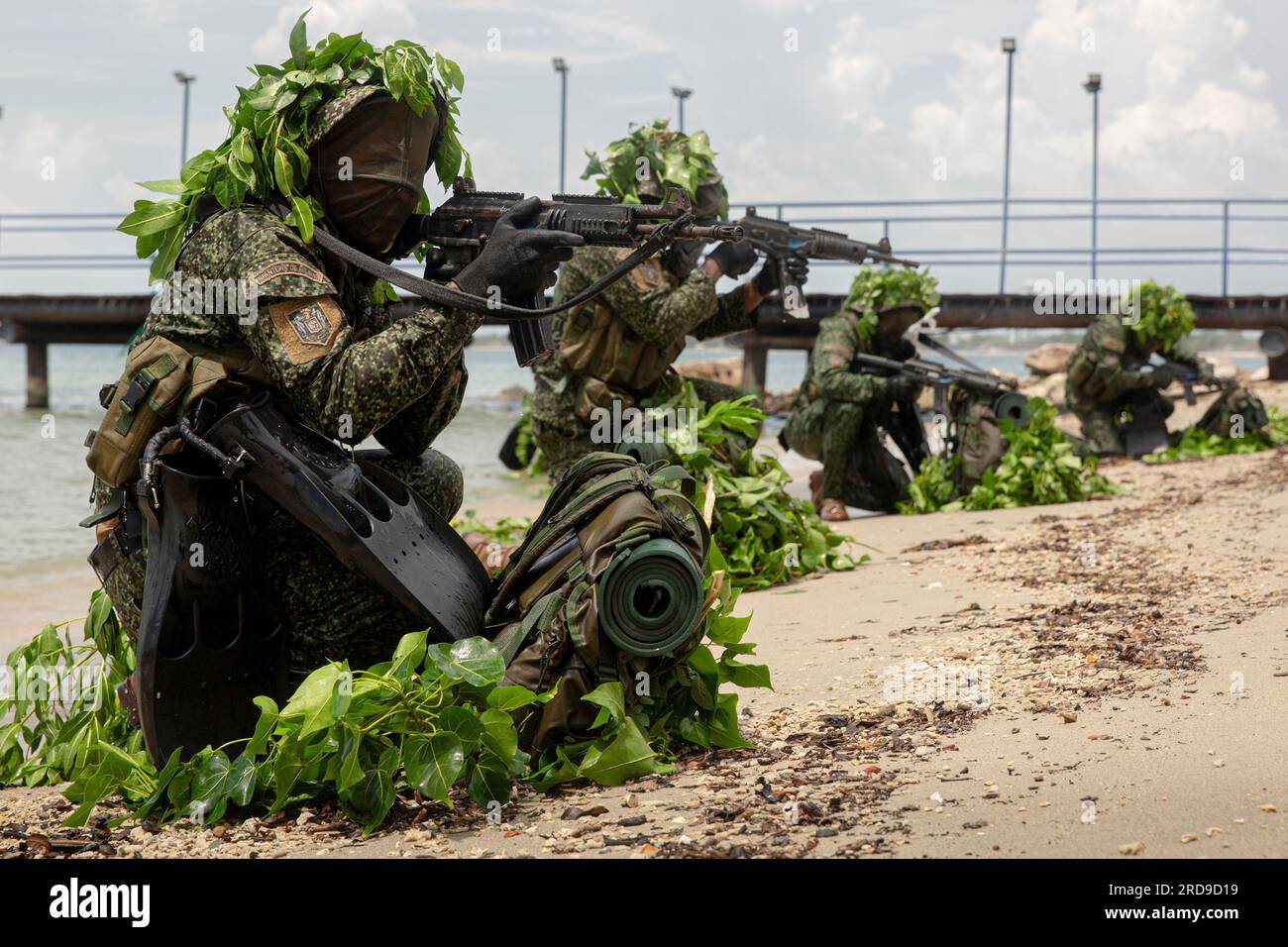 Colombian Marines provide security on a beach during an amphibious ...