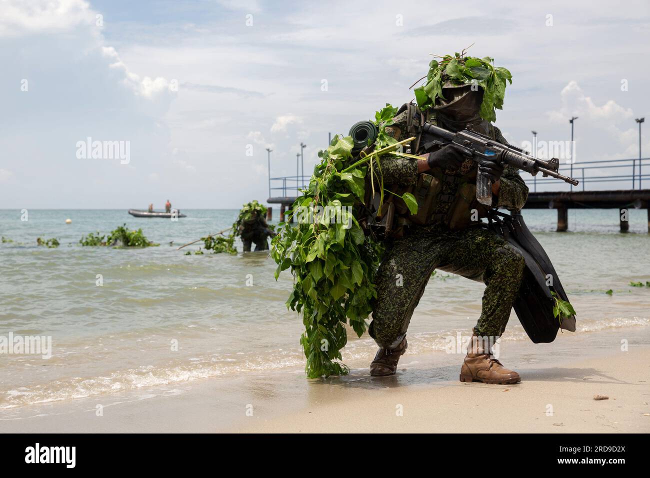 A Colombian Marine provides security on a beach during an amphibious ...