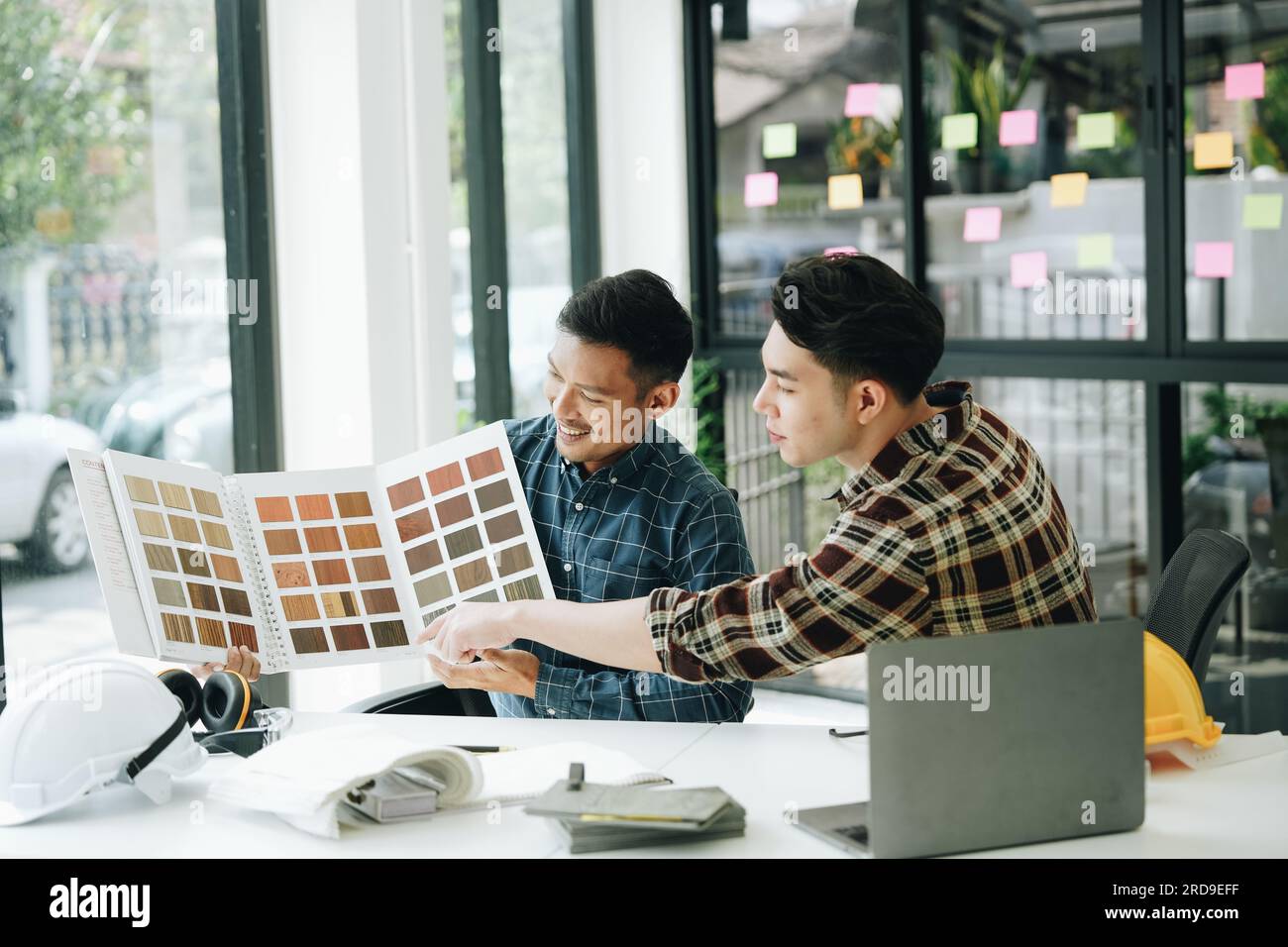 Engineers, designers and interior designers are finalizing the design of interiors by discussing ...