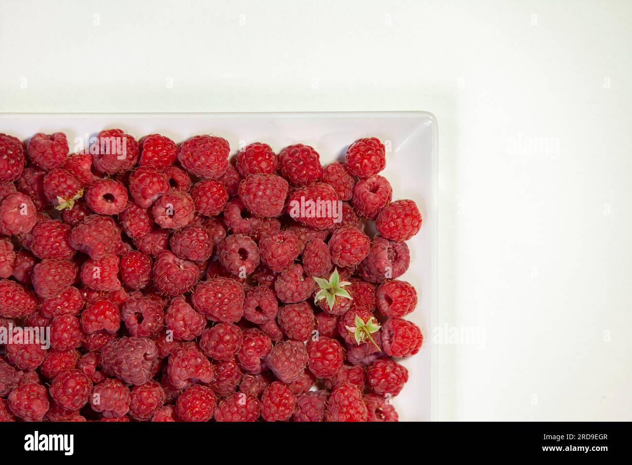 Raspberry background with copy space. Ripe red berries Stock Photo - Alamy