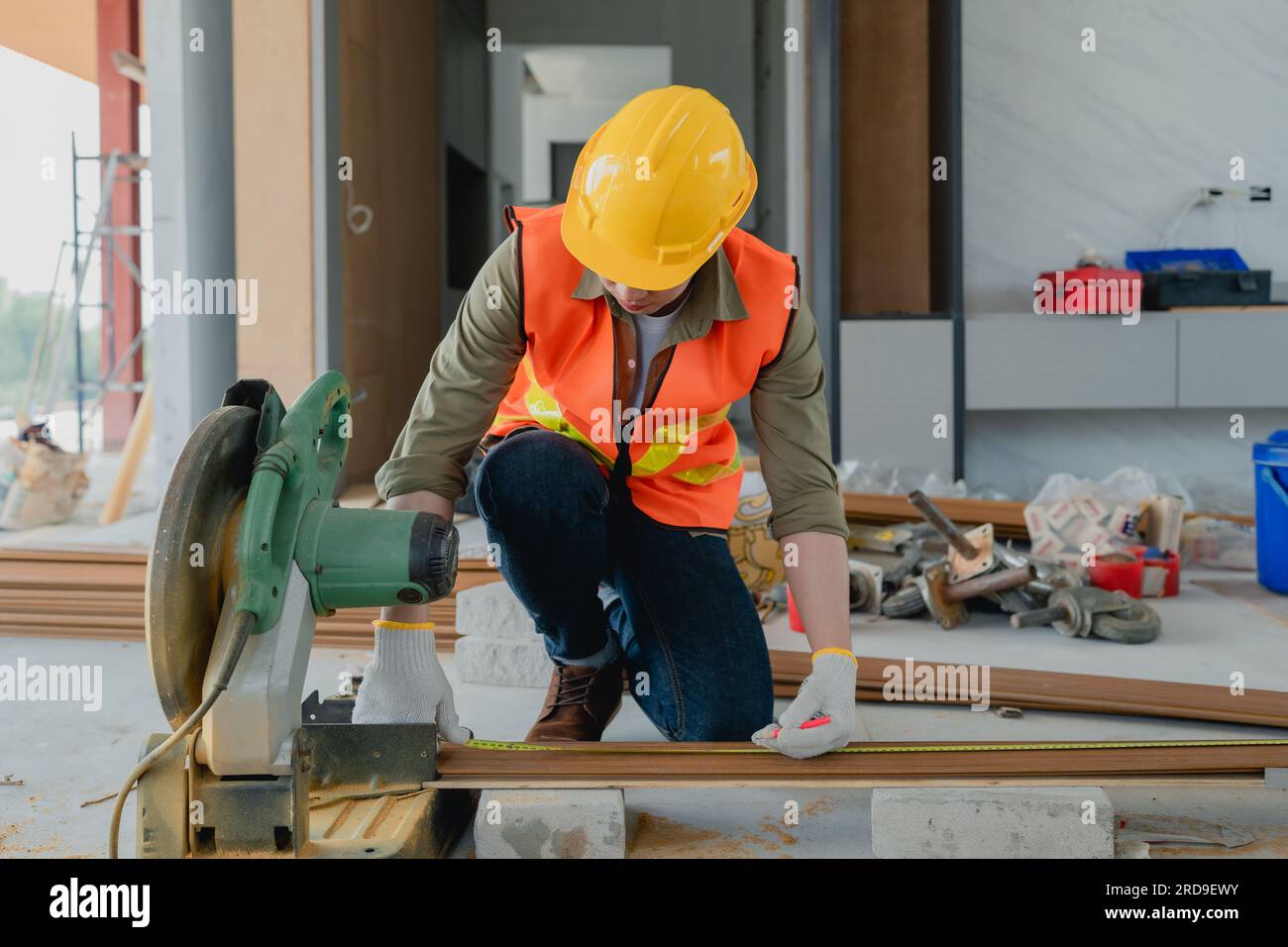 Structural worker dressed in safety gear and hard hat doing ...