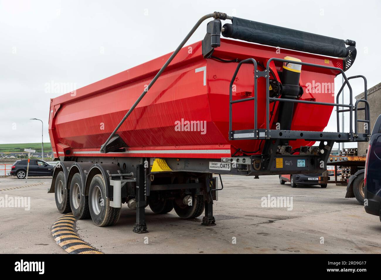 Kirkwall, Orkney Island, Scotland, UK. Large red painted tipper trailer ...
