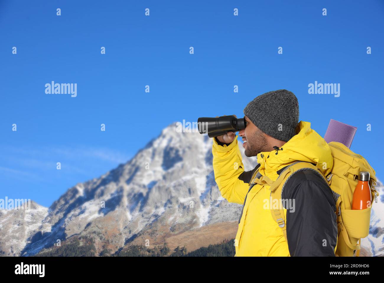 Tourist with backpack and binoculars in mountains Stock Photo - Alamy