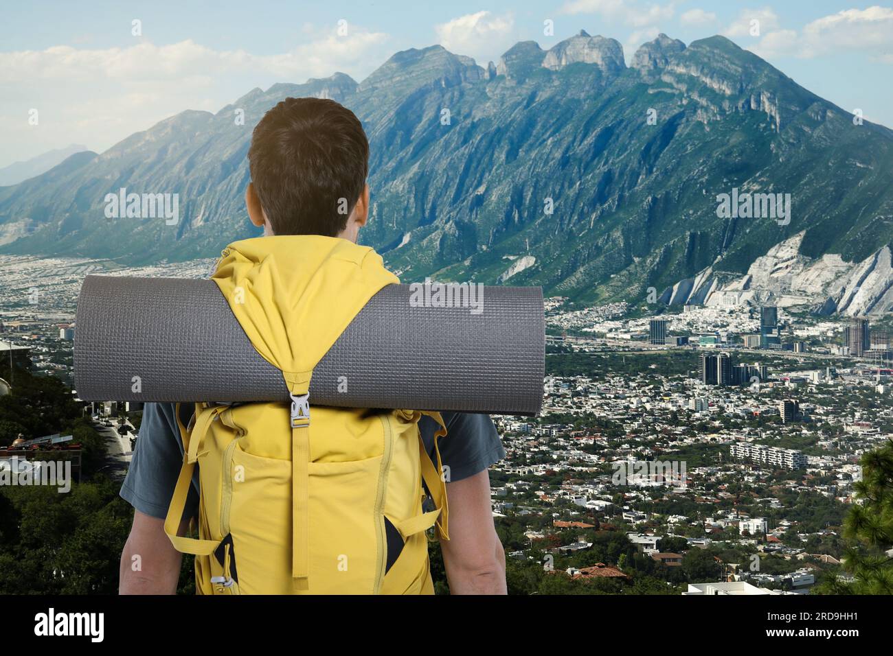 Tourist with backpack in mountains, back view Stock Photo - Alamy