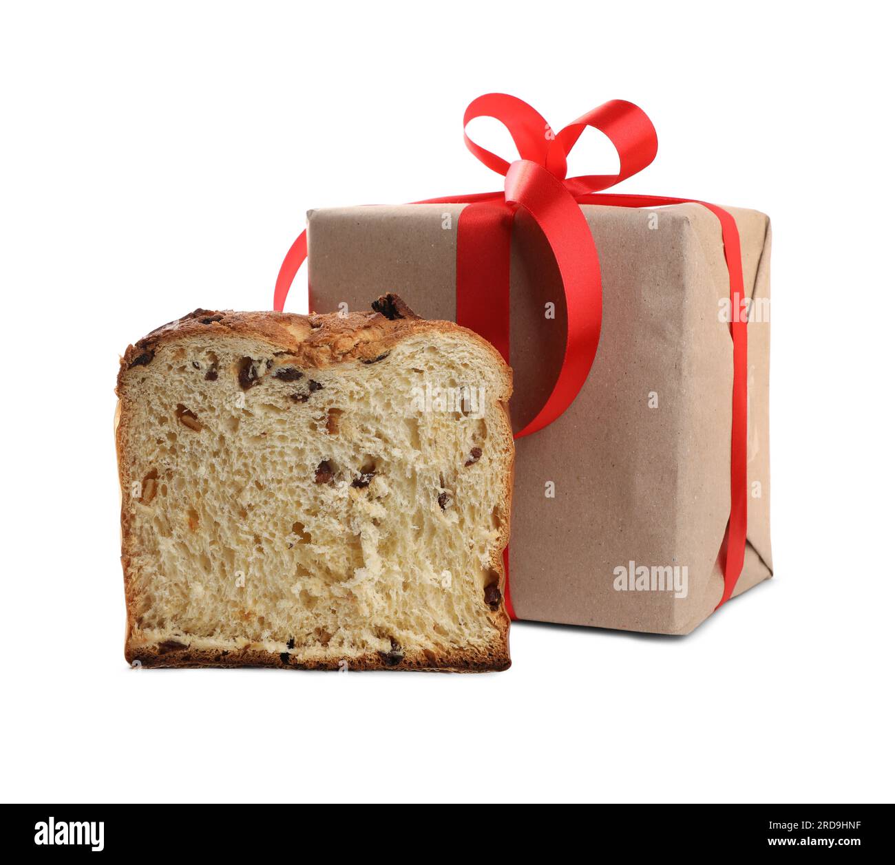 Half of delicious Panettone cake and gift box on white background ...