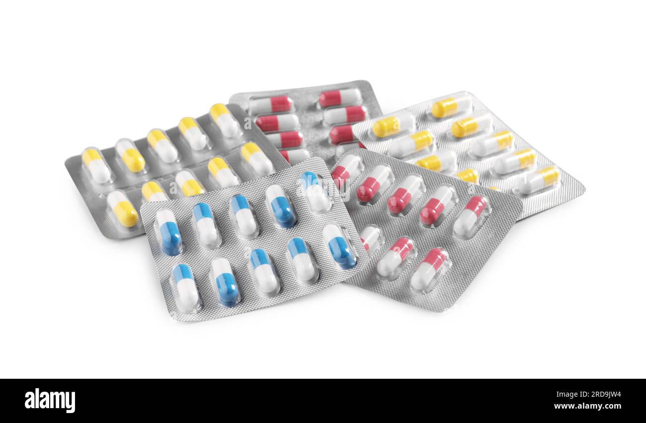 Many blisters with different pills on white background Stock Photo - Alamy