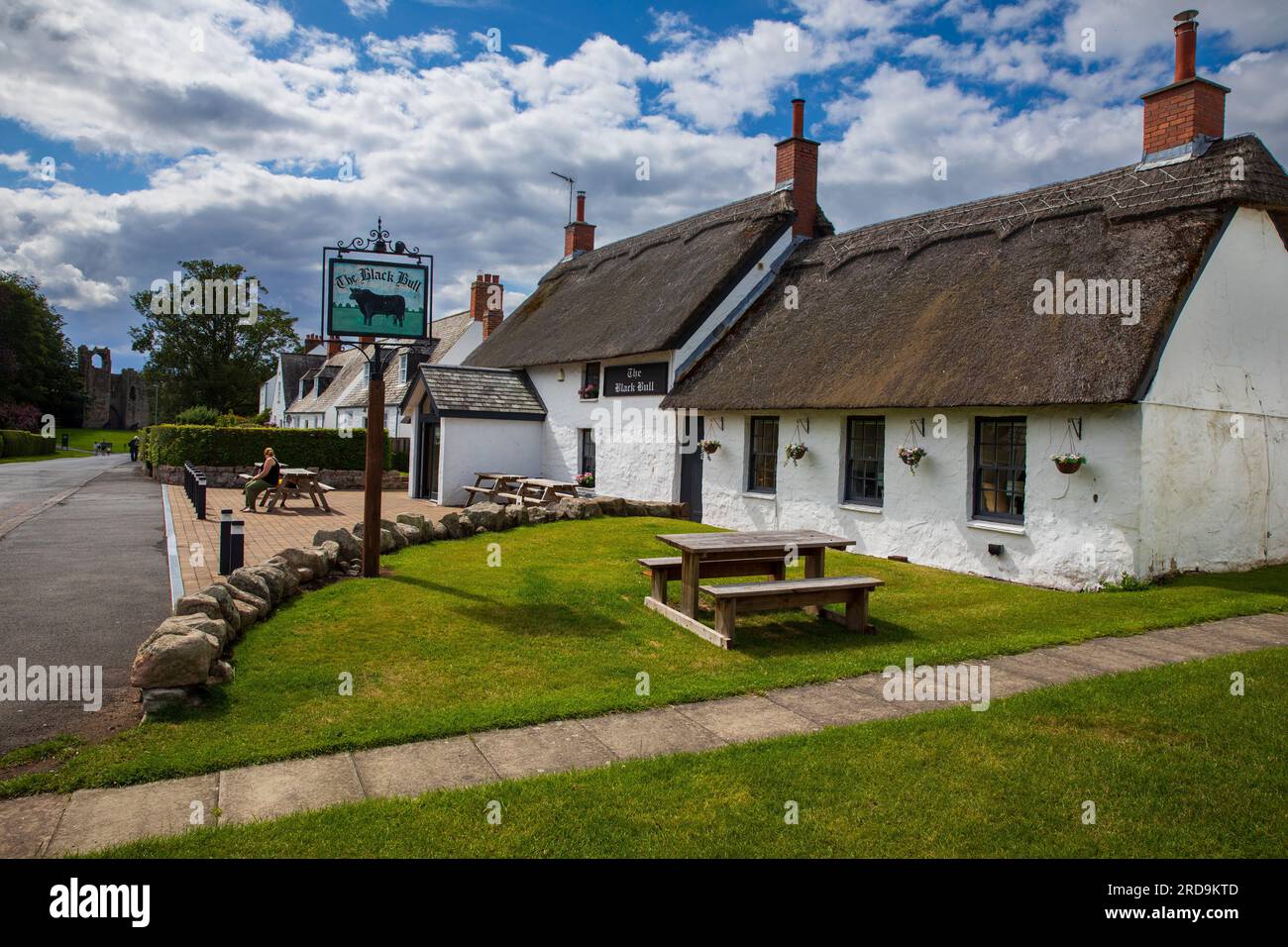 The village of Etal with its white painted Black Bull pub the only ...