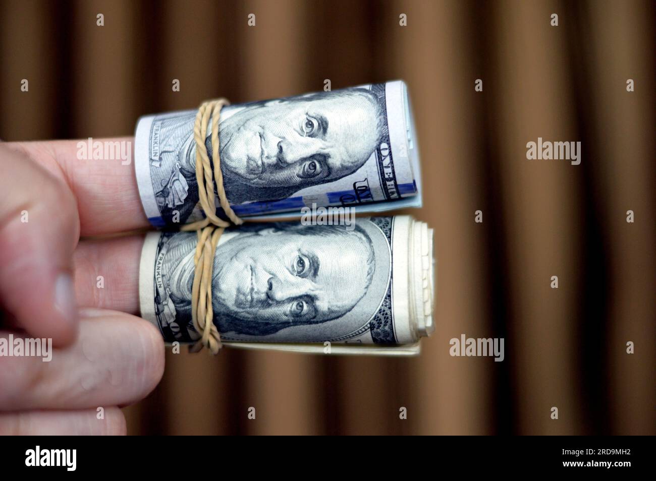 Rolls of 100 one hundred dollar banknote currency cash money old and ...