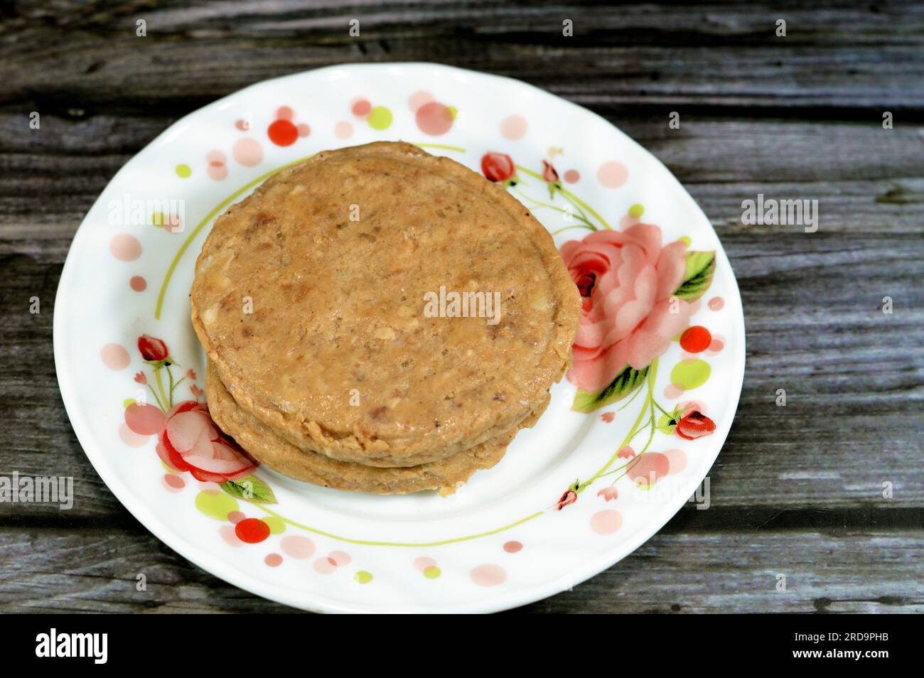 Raw uncooked beef burger ready to be cooked and fried in shallow oil ...