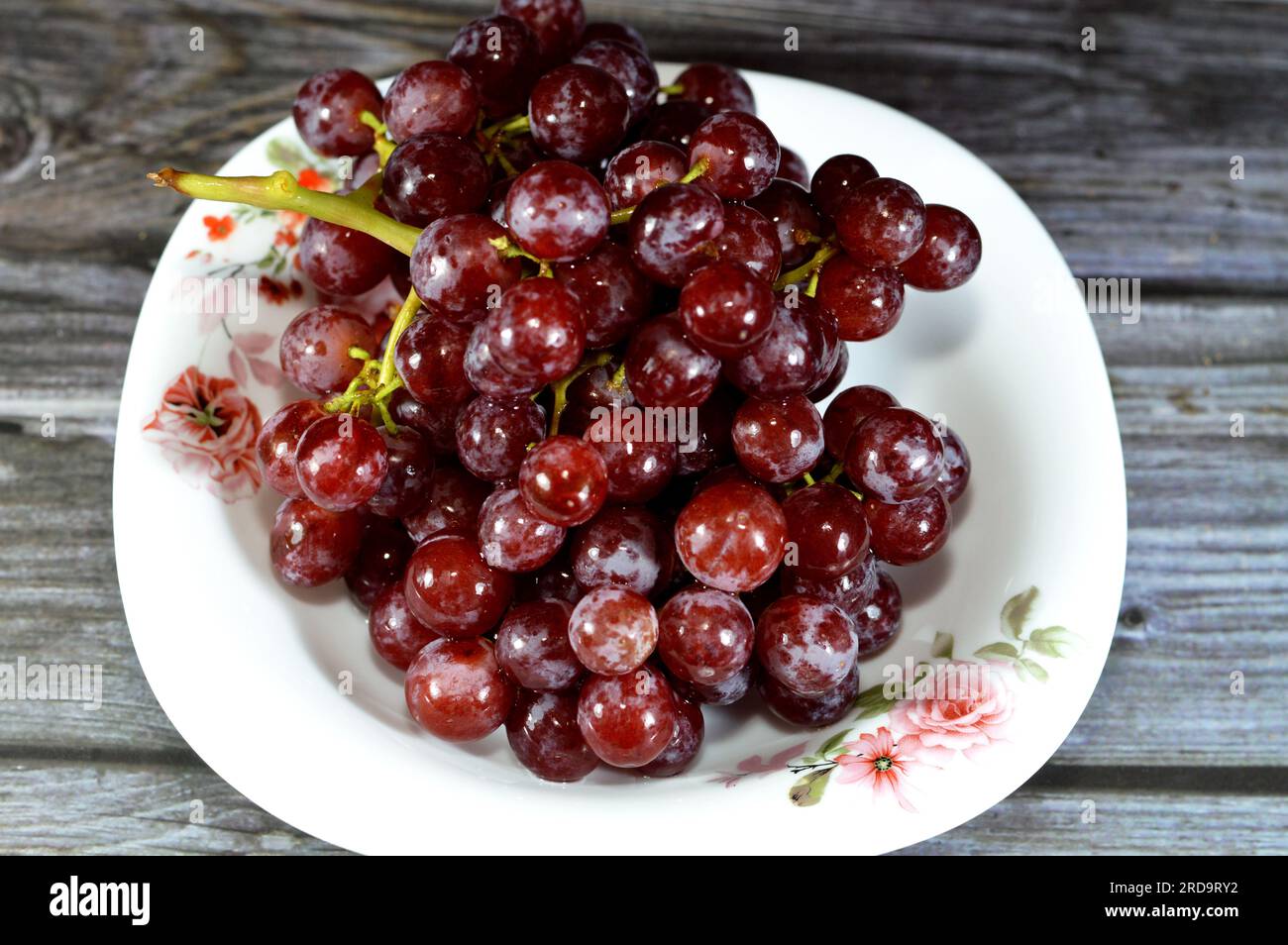 Red grapes, a fruit, botanically a berry of the deciduous woody vines ...