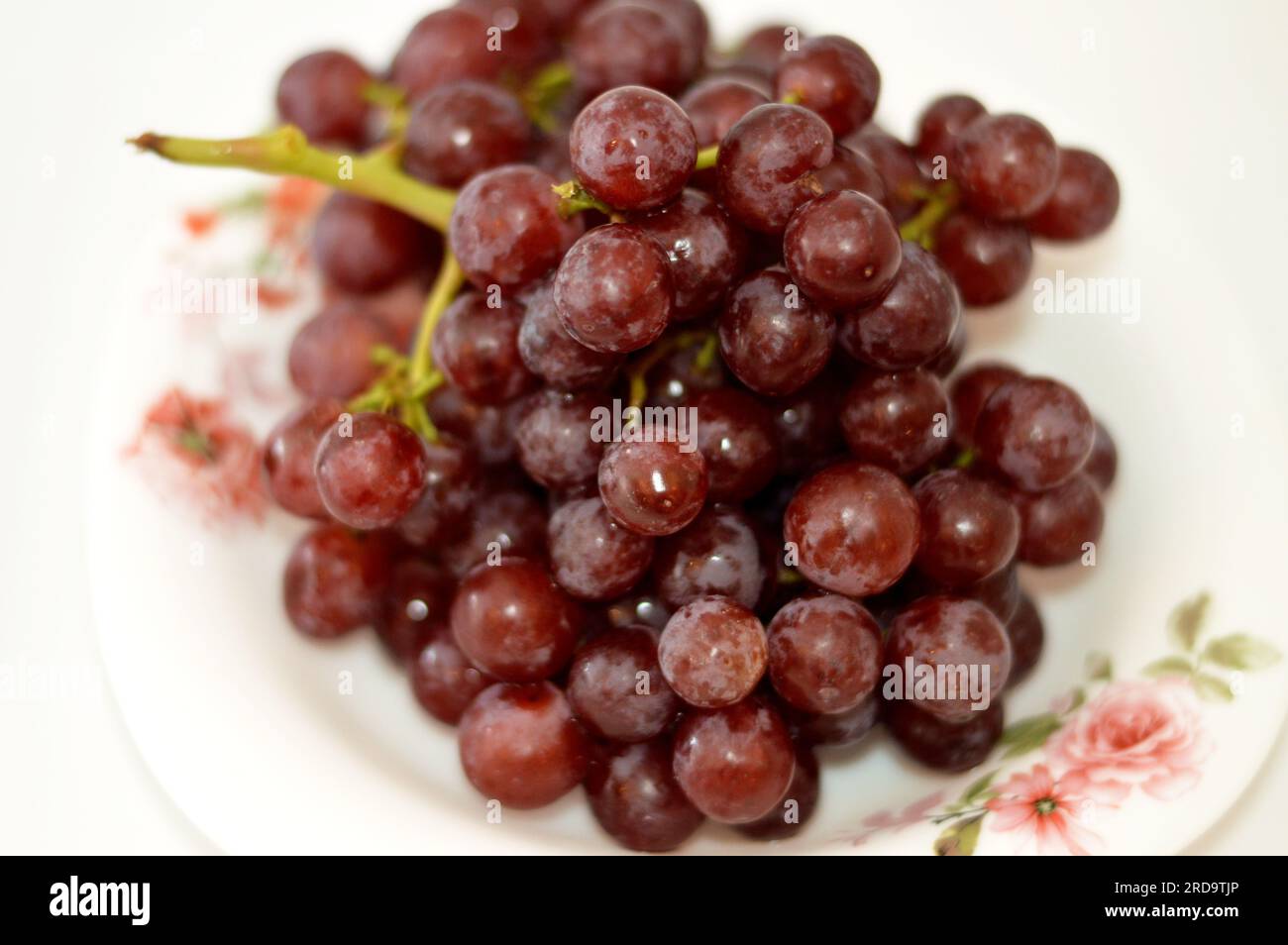 Red grapes, a fruit, botanically a berry of the deciduous woody vines ...