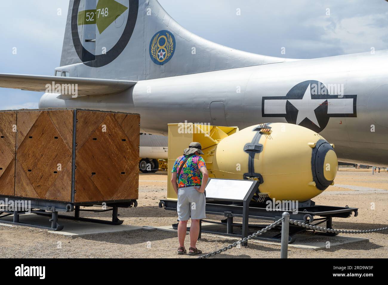 A man reads a plaque placed in front of a casing similar to the one ...