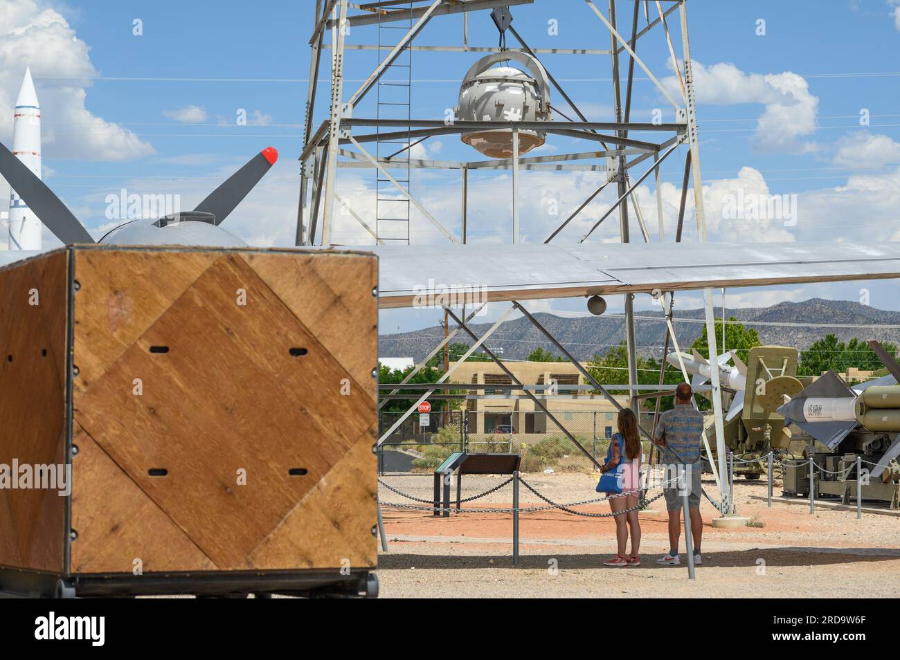 A couple stands in front of a replica of “Gadget”, the first atomic ...