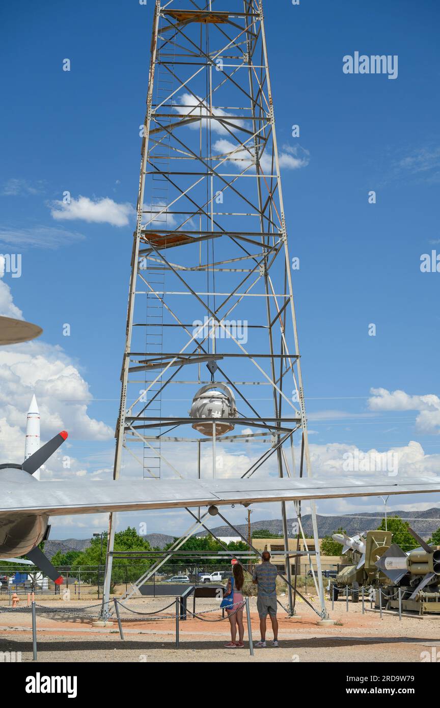 A couple stands in front of a replica of “Gadget”, the first atomic ...
