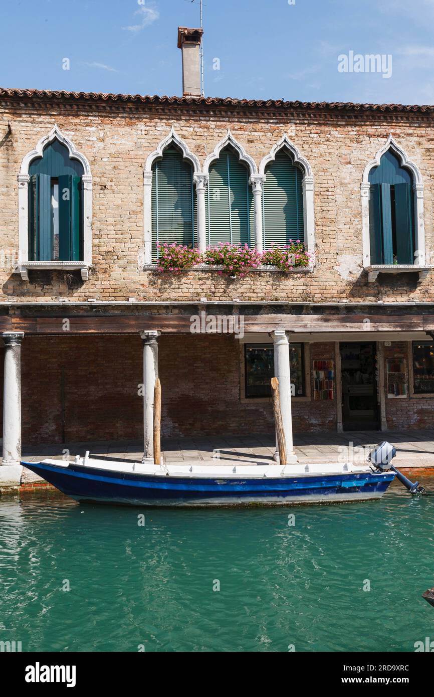 Boat outside Venice house Stock Photo - Alamy