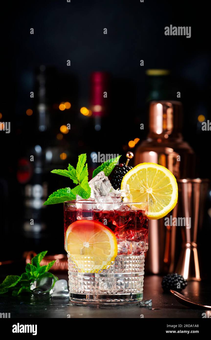 Bramble alcohol cocktail drink with dry gin, liqueur, syrup, lemon ...