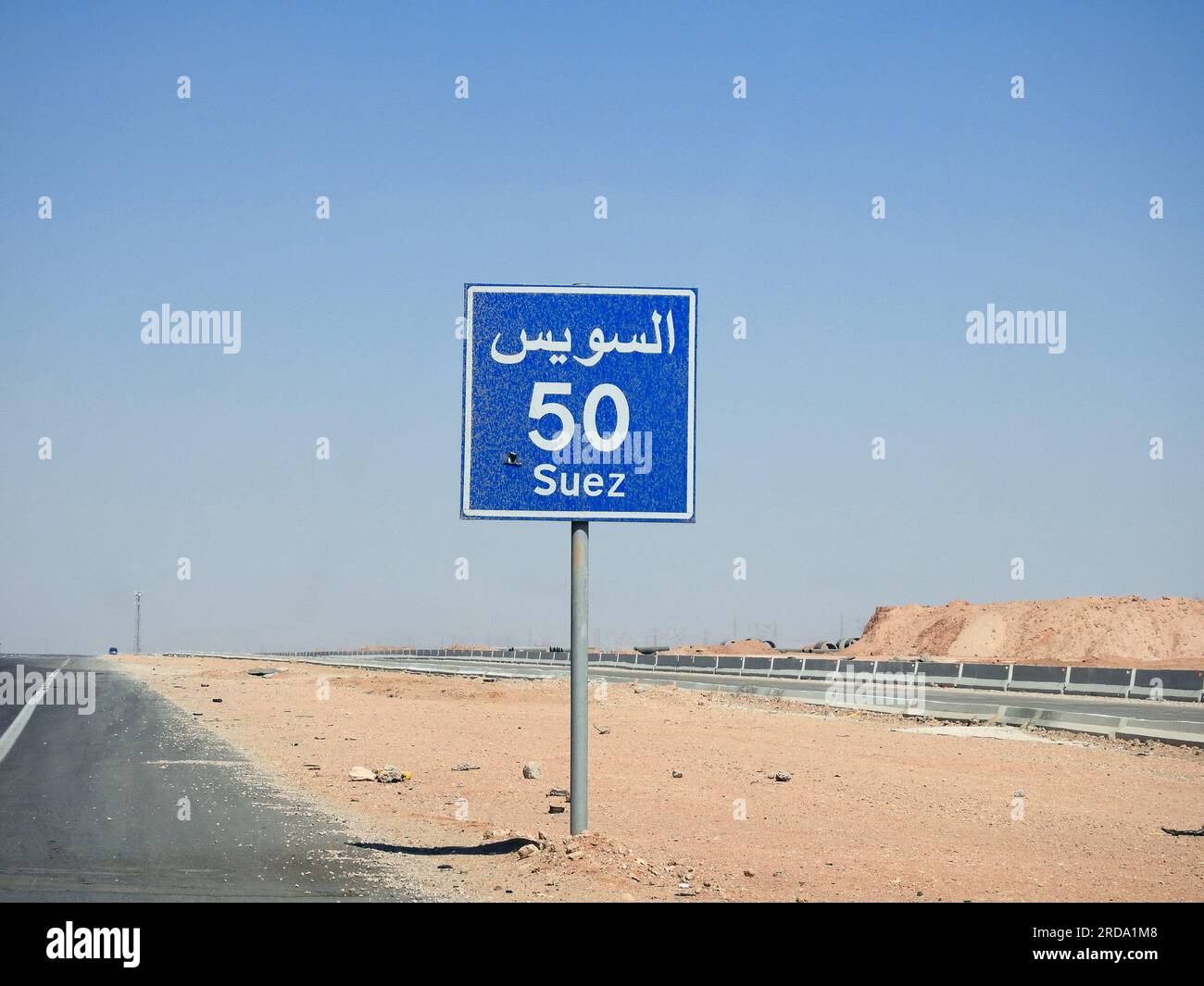 A road sign board in Suez Cairo highway gives the remaining distance to ...