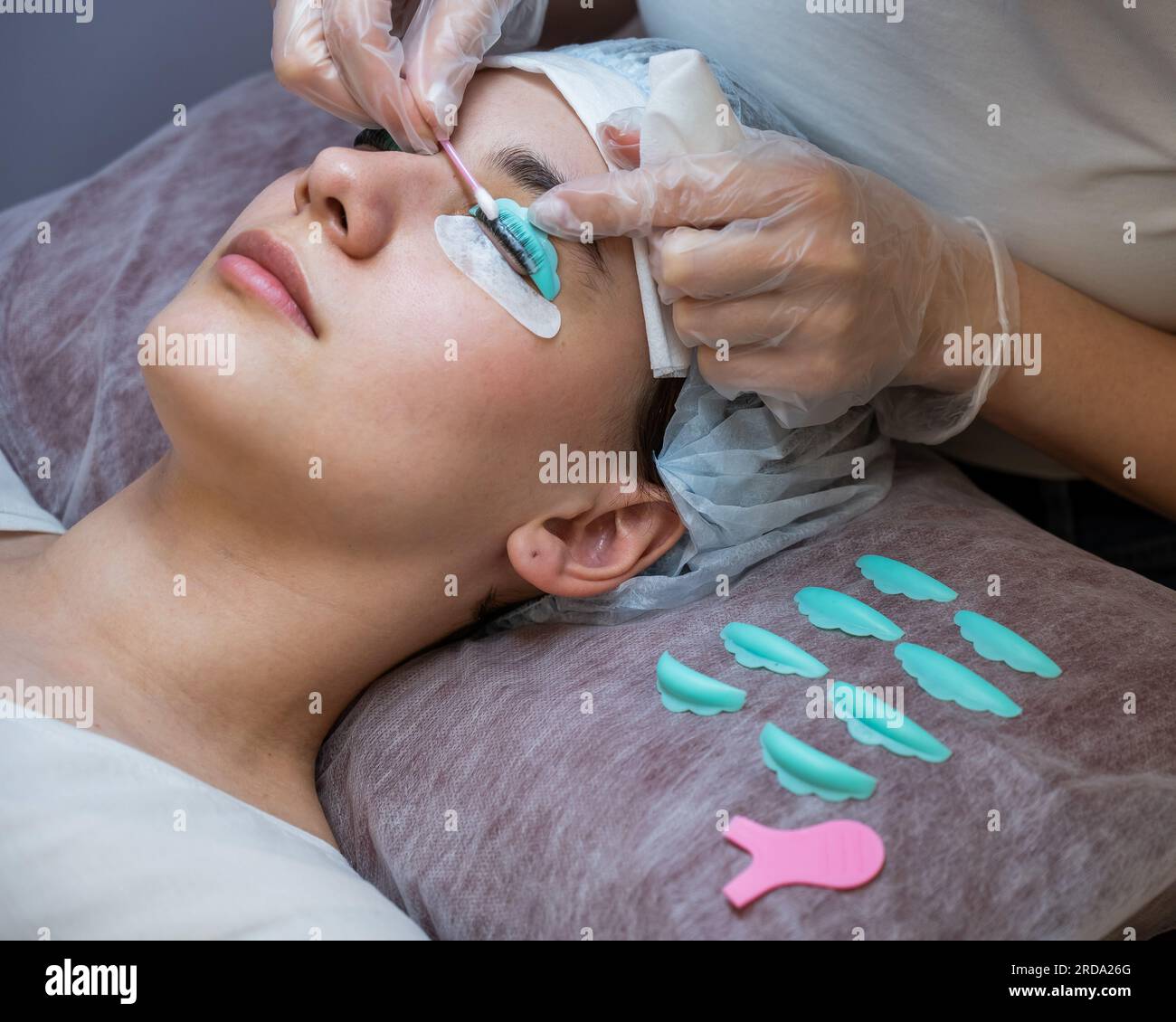 The master removes the composition for lamination from the client's ...