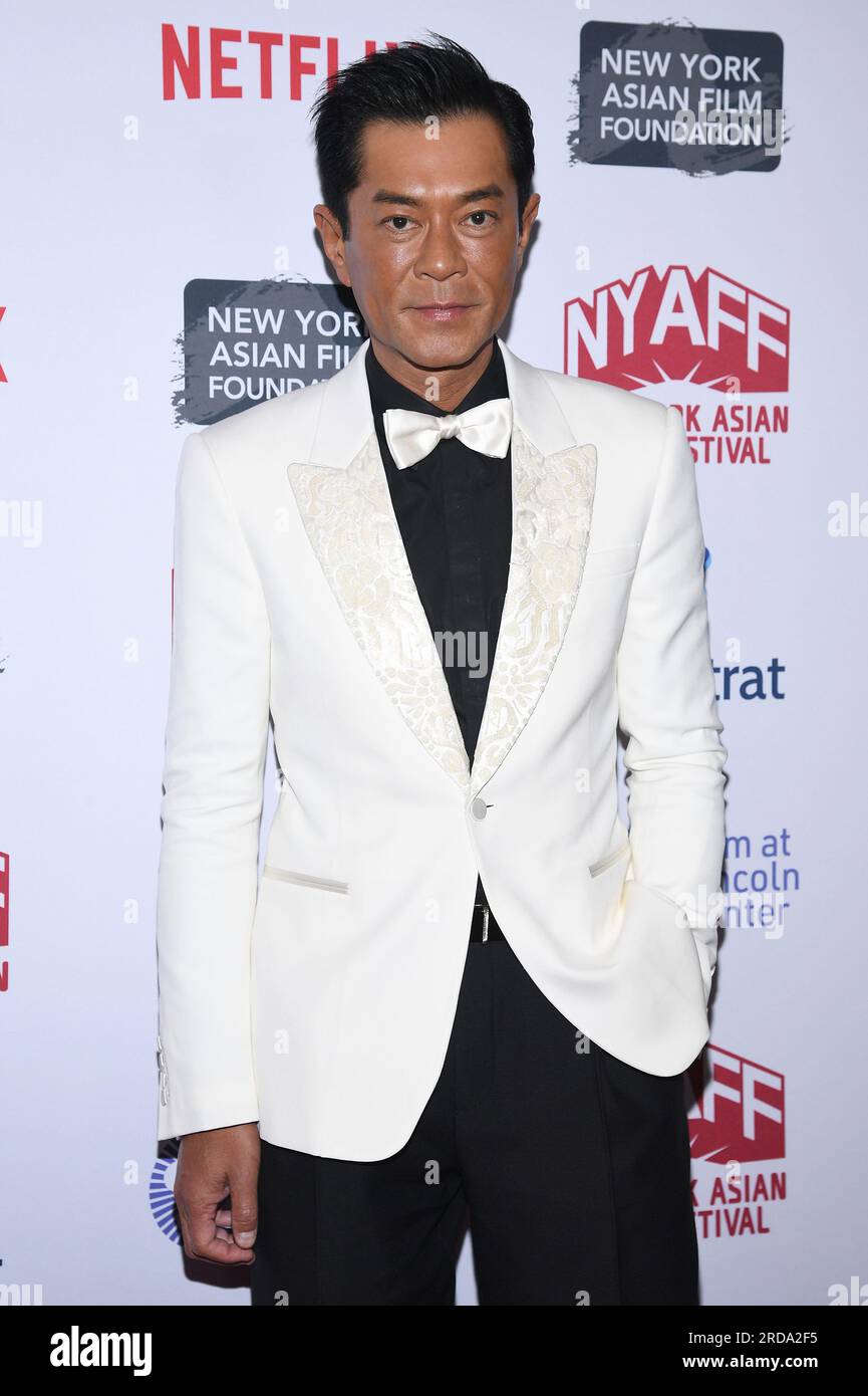New York, USA. 19th July, 2023. Actor Louis Koo walks the red carpet at ...