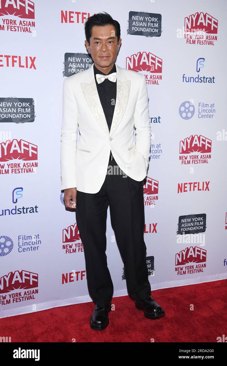 New York, USA. 19th July, 2023. Actor Louis Koo walks the red carpet at ...