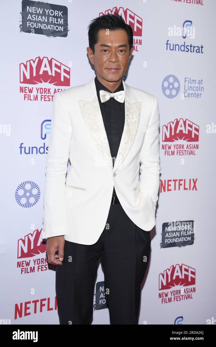 New York, USA. 19th July, 2023. Actor Louis Koo walks the red carpet at ...