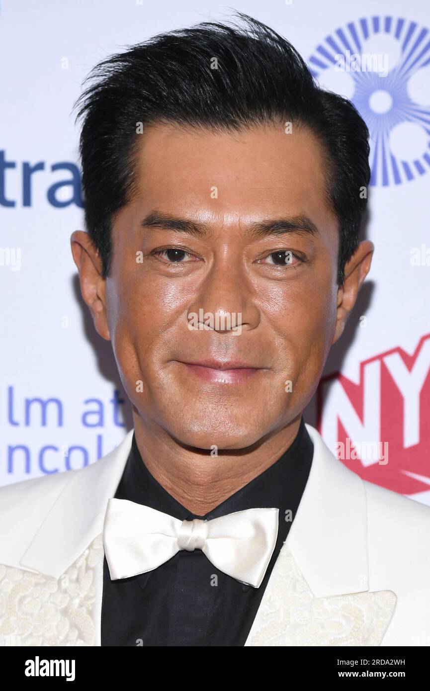 New York, USA. 19th July, 2023. Actor Louis Koo walks the red carpet at ...