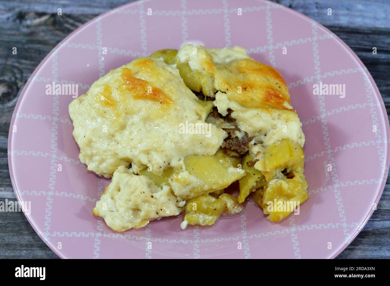 Baked zucchini courgette bechamel sauce and ground minced meat and ghee ...