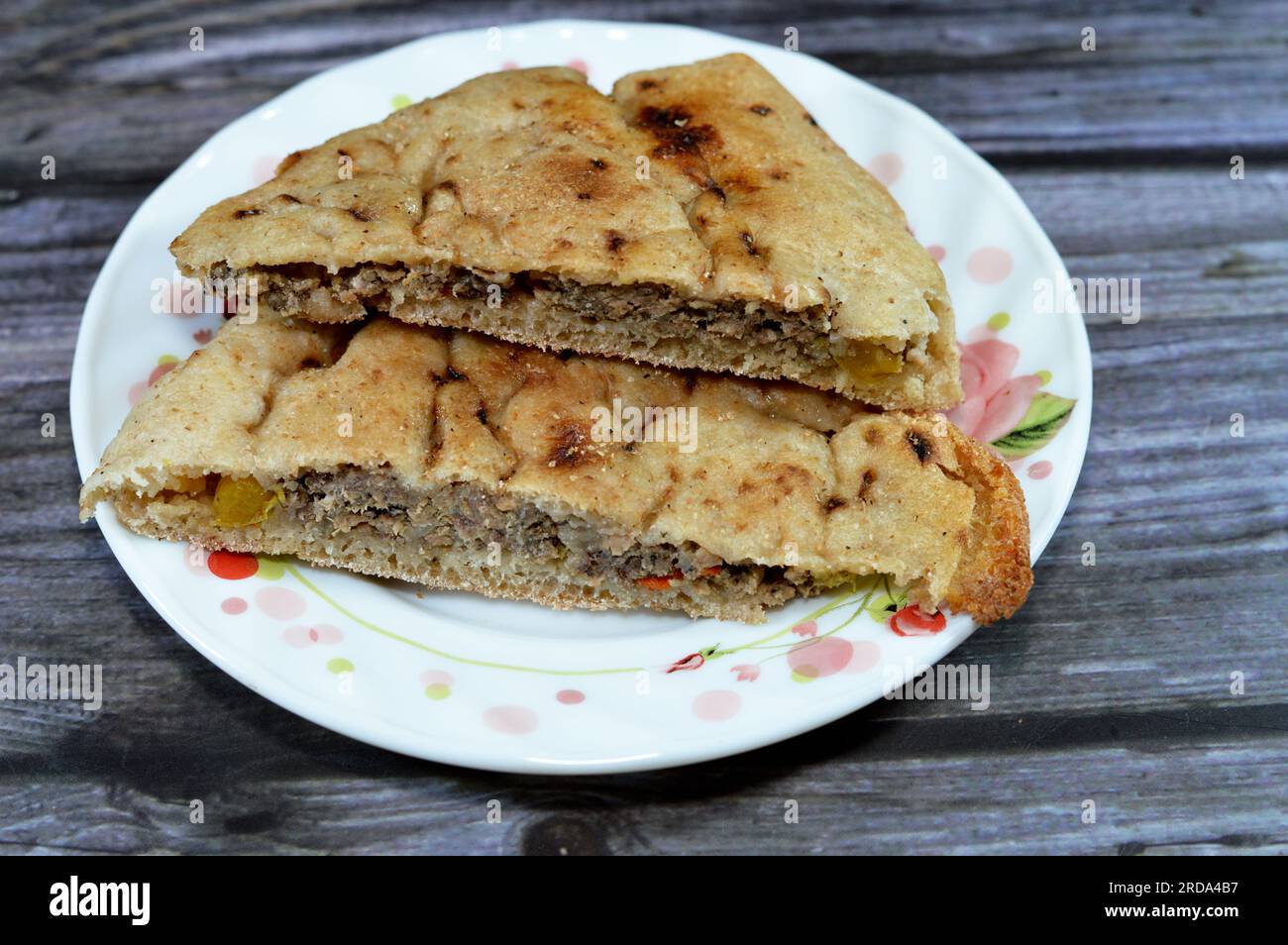Traditional Egyptian dish Hawawshi, pita stuffed with minced meat and ...