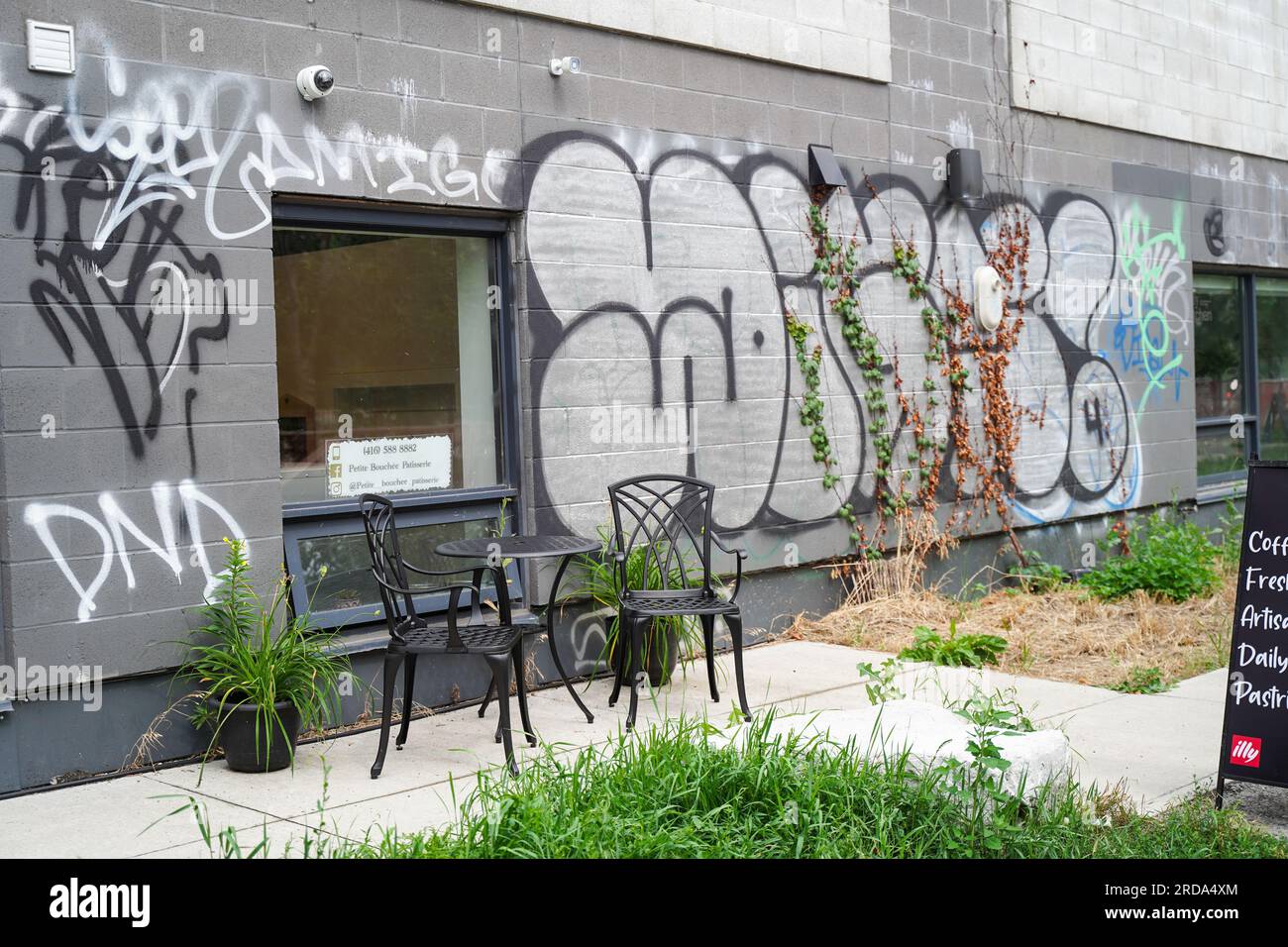 a commercial plaza wall painted with graffiti Stock Photo - Alamy