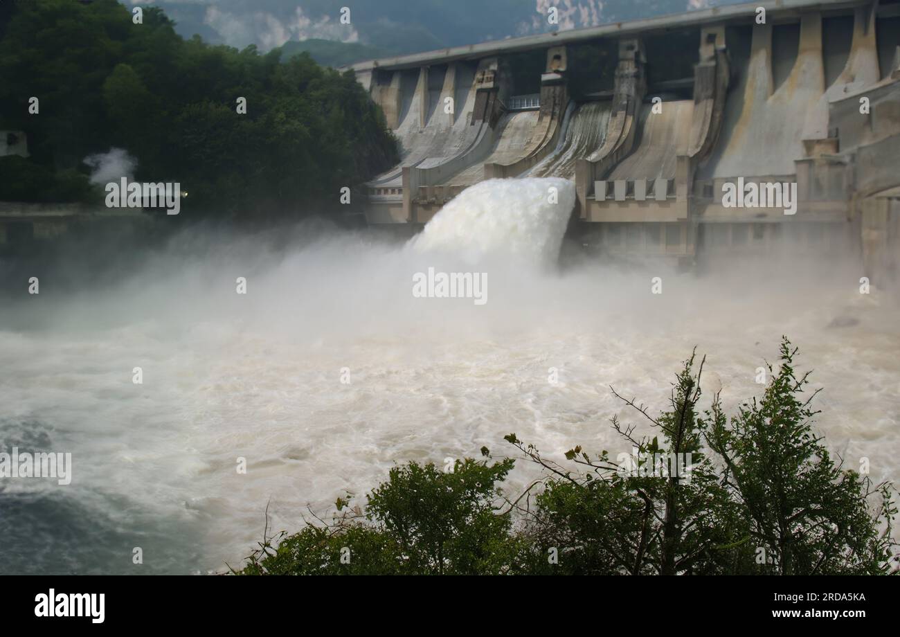 Water cascading over an old dam in nature Stock Photo - Alamy