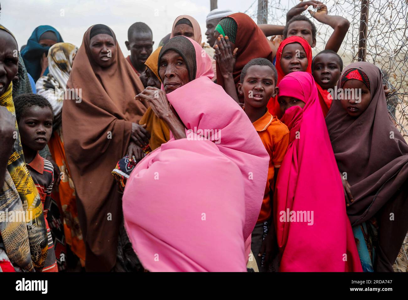 Newly arrived Somali refugees wait outside a UNHCR processing center at ...