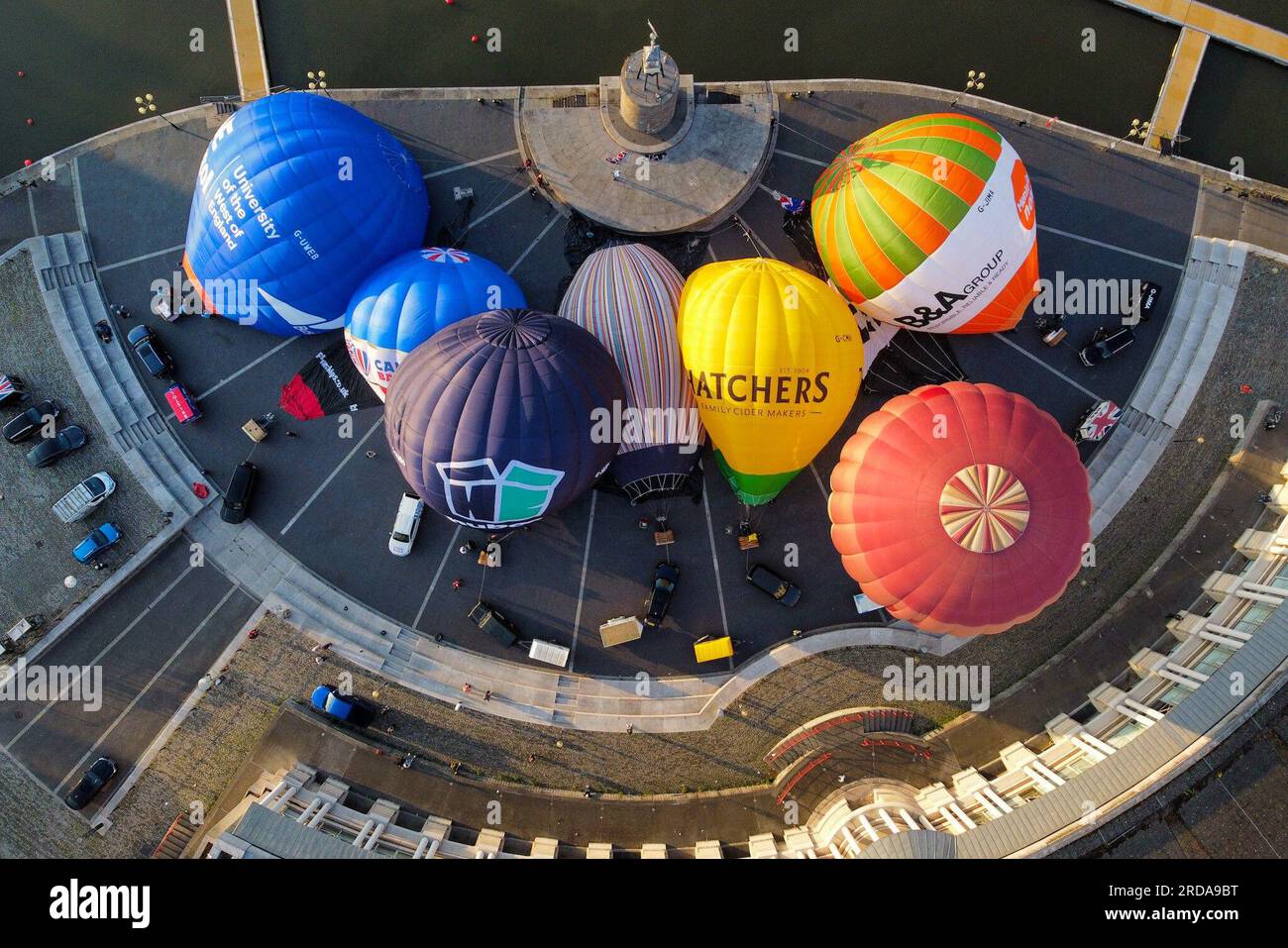 Hot air balloons inflate and tether from Bristol Harbourside in the ...