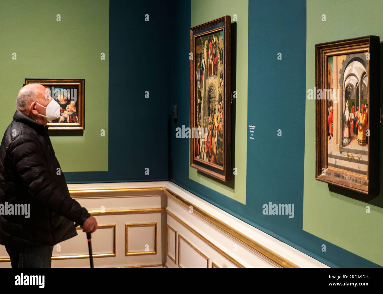 An elderly man with a cane at the exhibition. Exhibition The Age of ...