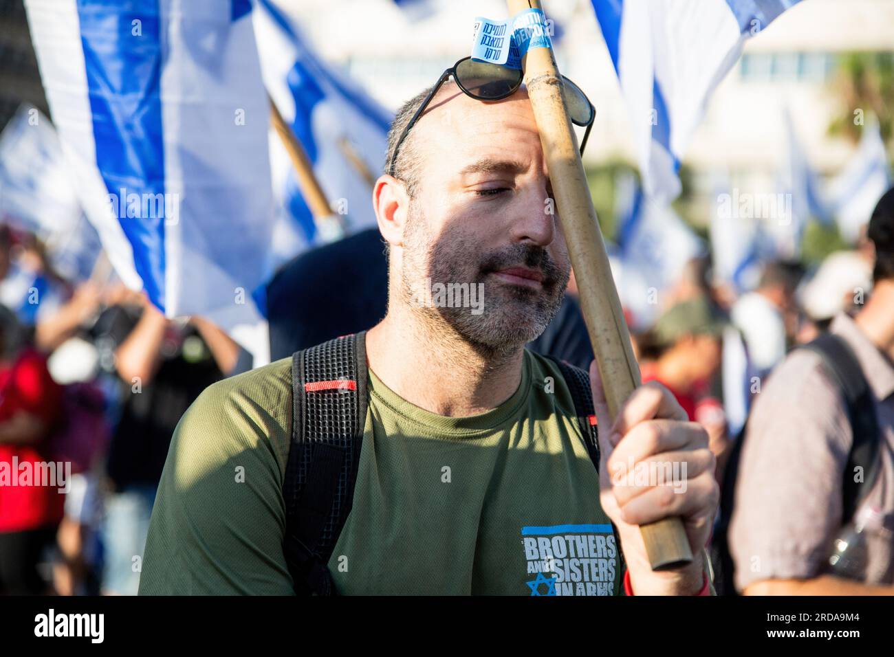 Tel Aviv, Israel. 19th July, 2023. An Israeli reservist holds an ...