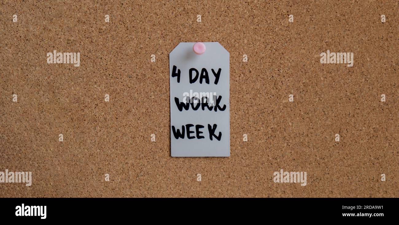 4 day work week text on paper note pinned to desk four day working week concept. Modern approach ...