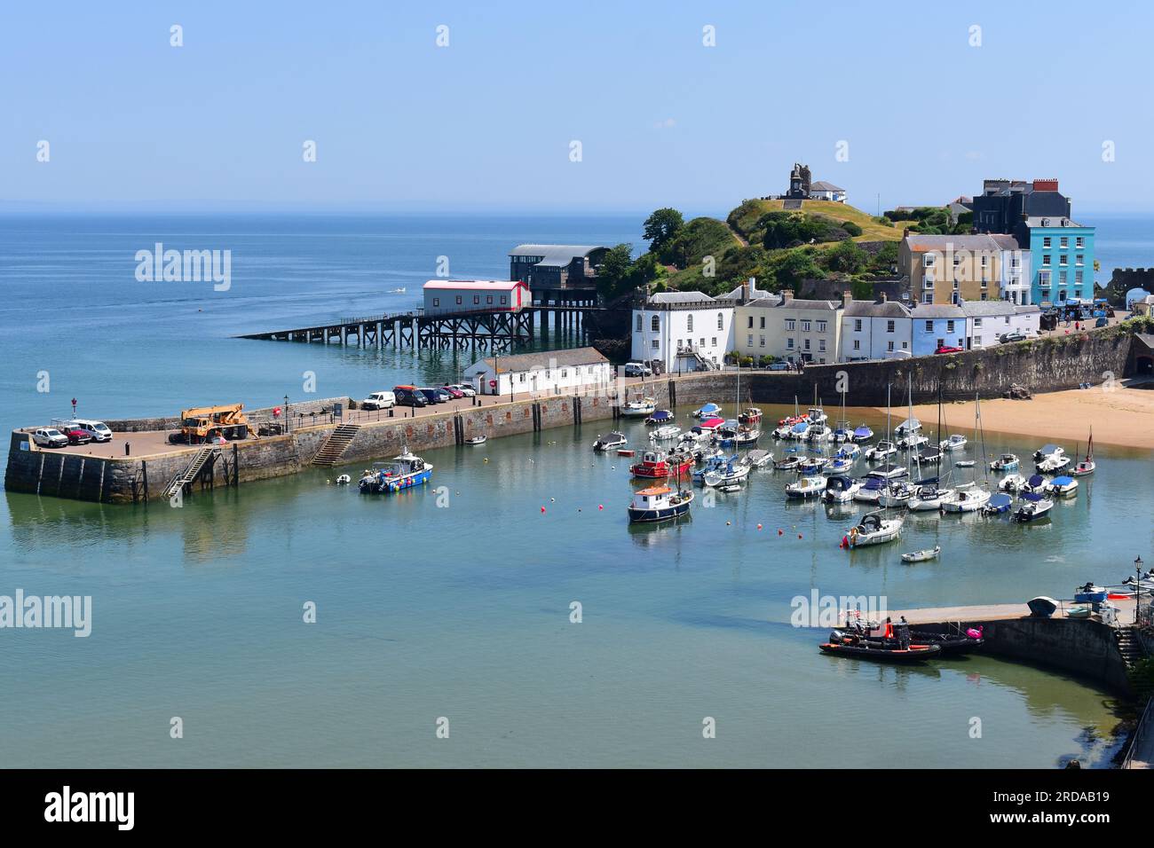 A view of Tenby harbour with tide coming in, Both old and new lifeboat ...