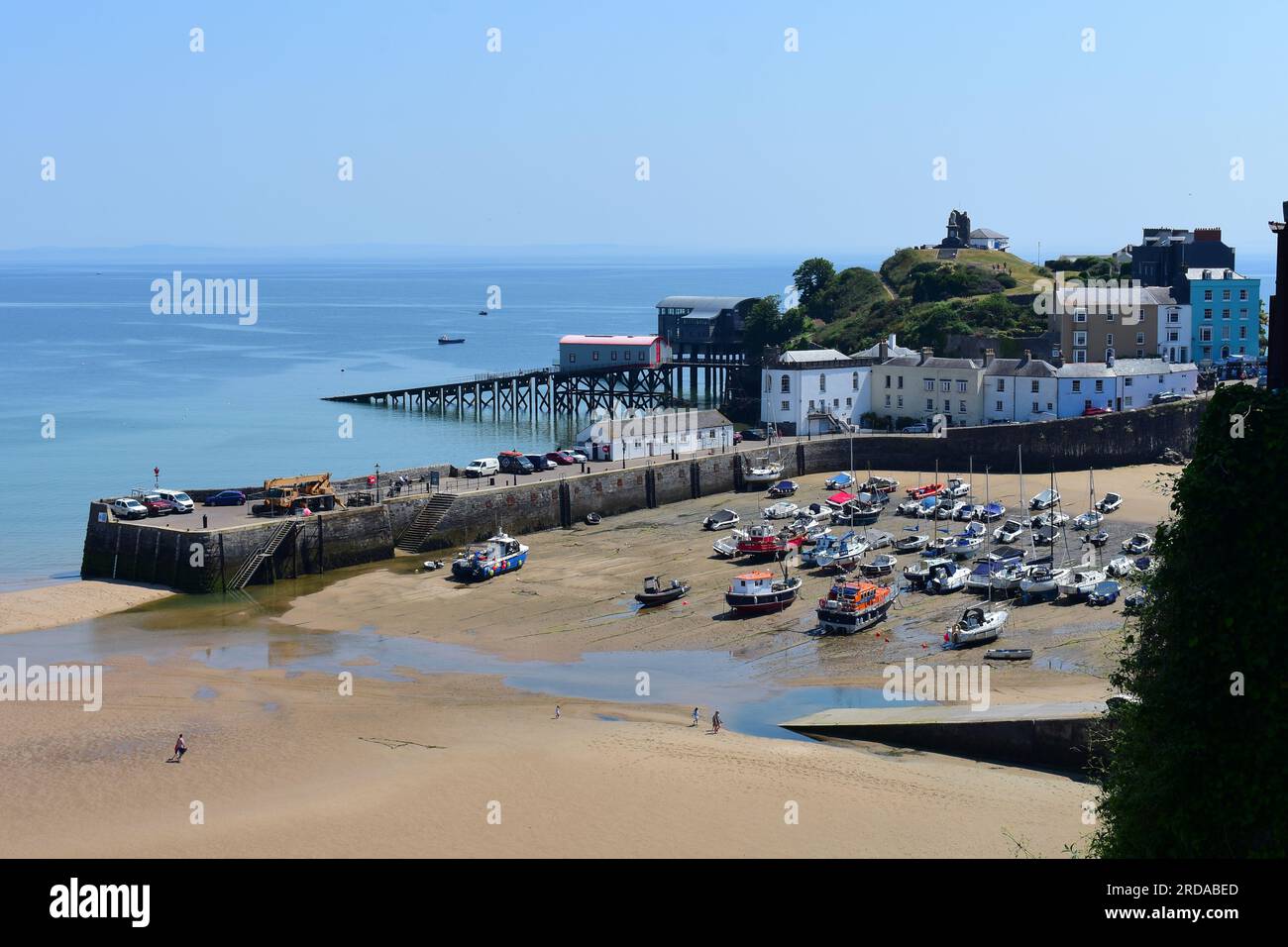 A view of Tenby harbour with tide coming in, Both old and new lifeboat ...