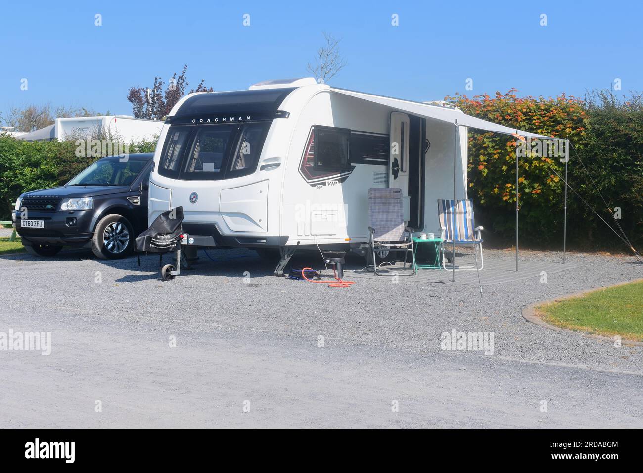 A modern car and caravan outfit on a fully serviced pitch at the Little ...